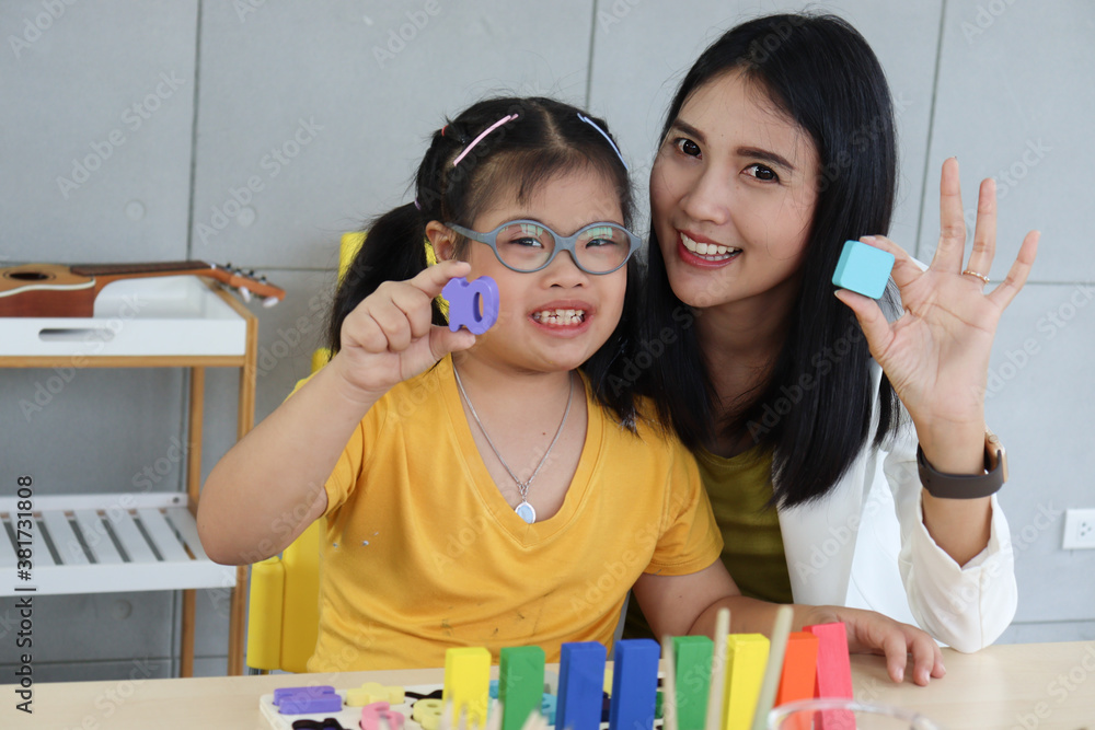 Disabled kids classroom, children having fun during study at school ...