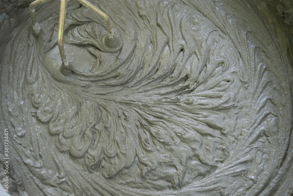 Tool rotation marks in gray mortar, cement prints. Mixing concrete with ...