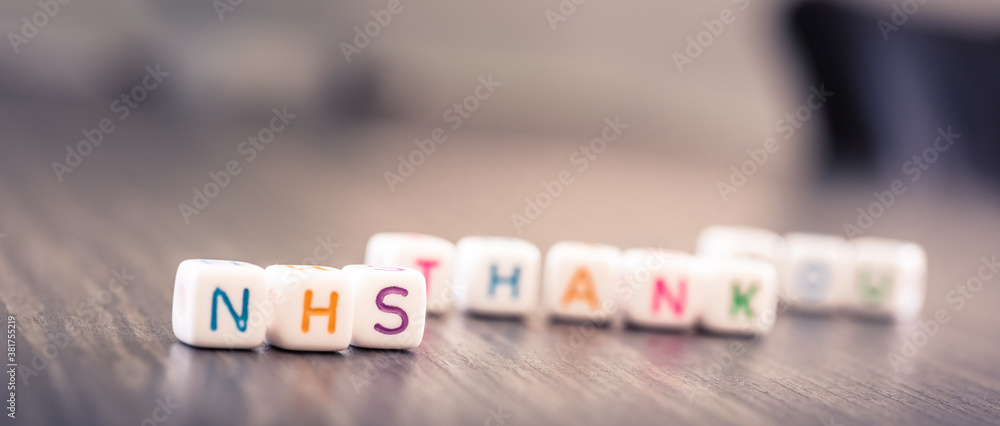 NHS staff thank you for all you hard work - colourful letters on white ...