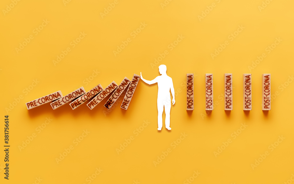 pre-corona and post-corona. human figure stops falling wooden blocks ...