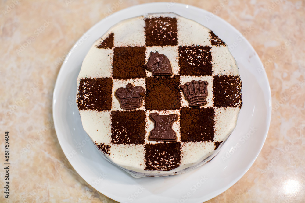 Sponge cake with butter cream. Cake in the form of a chessboard. A gift ...