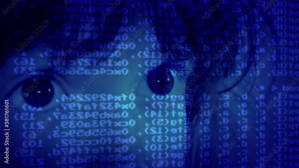 The face and eyes of a little girl looking at a computer screen, with ...