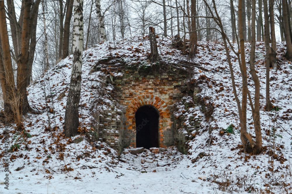 Underground abandoned bunker. Old ruined brick building under ground ...