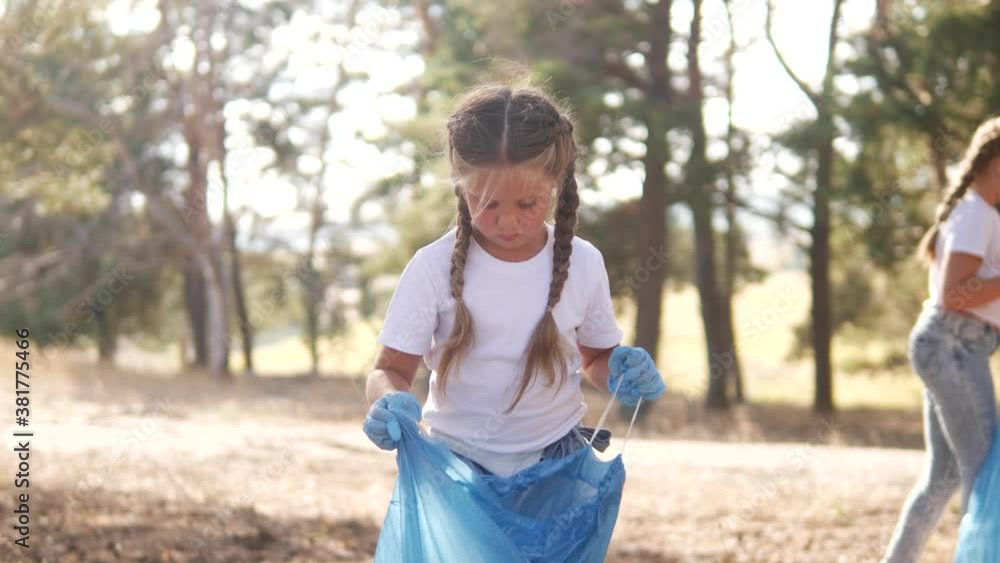 kid collecting trash volunteer teamwork. child group happy family on ...