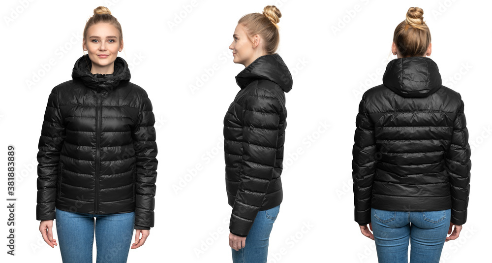 Young female model posing in black down jacket isolated on white ...