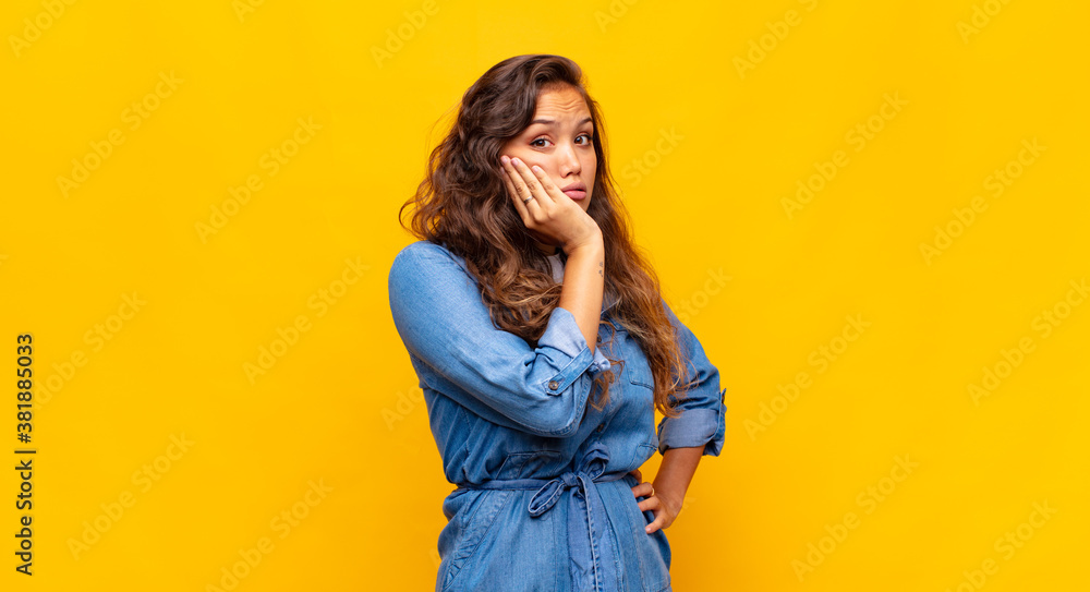 feeling shocked and astonished holding face to hand in disbelief with ...