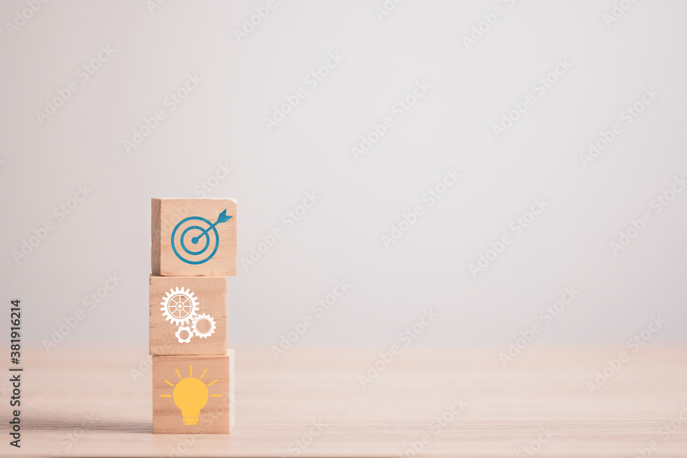 Achievement business target concept , Stacking wooden cubes block which print screen target ...