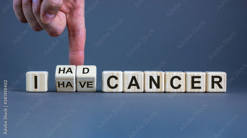 Symbol for a succesful cancer treatment. Hand turns cubes and changes ...