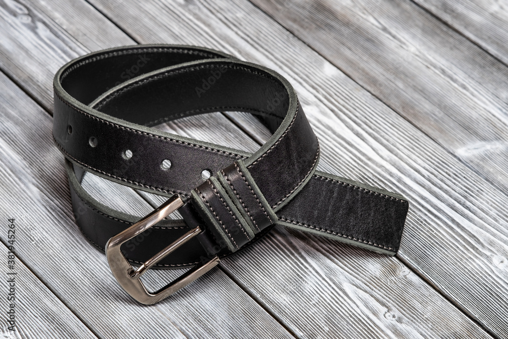 The belt is rolled up, next to a gift box. Template for the design of ...