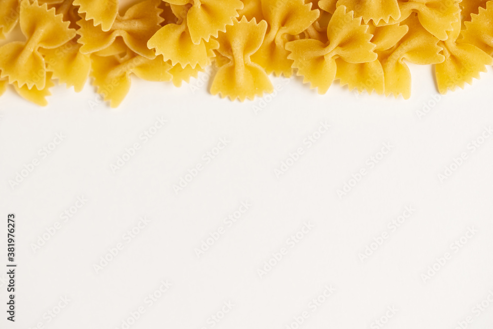 Farfalle - one of types of traditional Italian pasta. Border of ...
