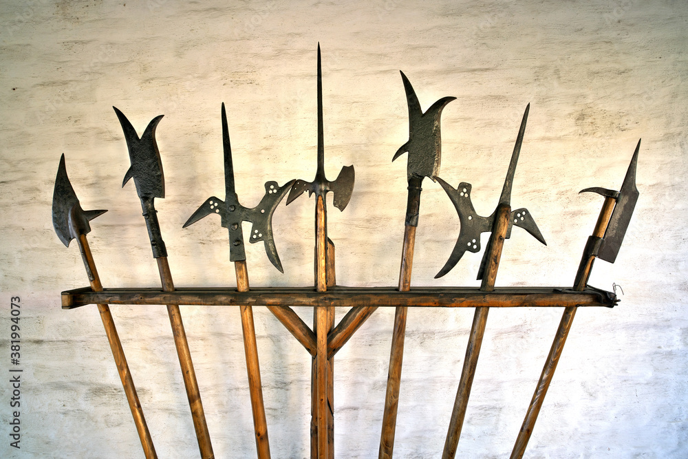 The old ancient medieval cold weapons, axes, halberds, knives, swords ...
