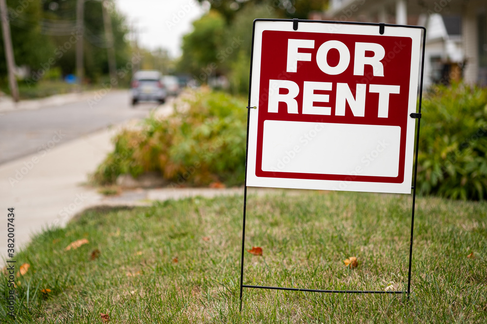 For rent sign in the yard in front of a house Stock Photo | Adobe Stock