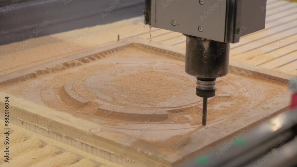CNC engraving, woodworking, carving, industrial, manufacturing concept ...