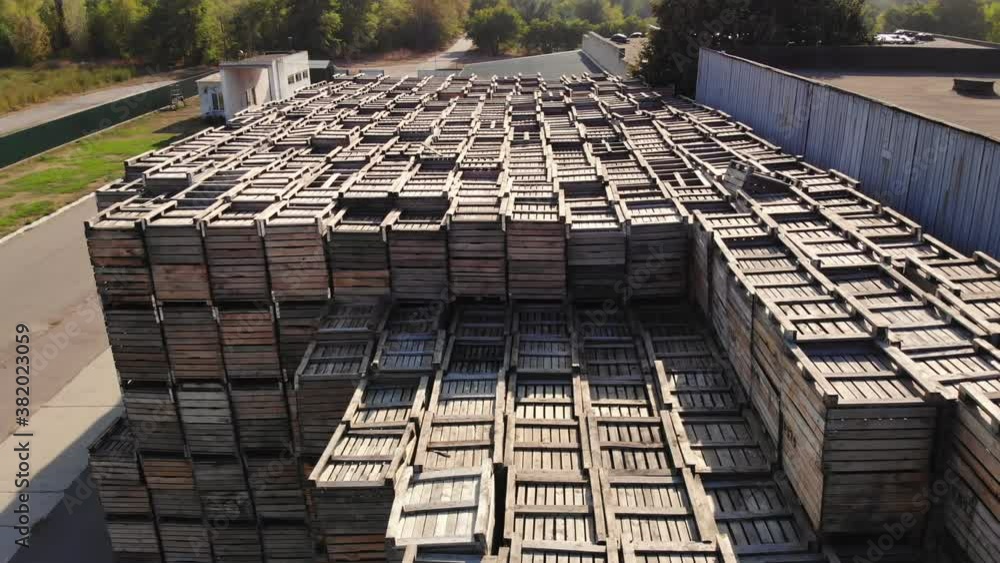 Video Stock warehouses. stacks of wooden crates for fruit, large boxes ...