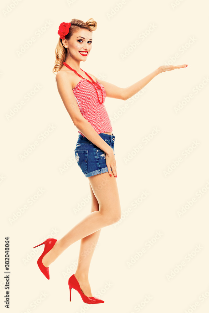 Full body portrait image - very happy woman pointing at something. Girl ...