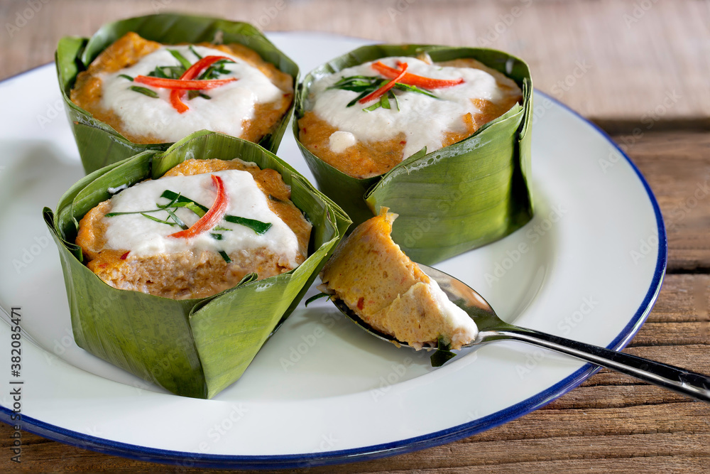 Steamed fish with curry paste in banana leaf cup and *Yor leaves (Thai ...