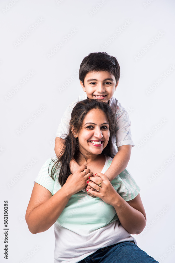Indian pretty young mother and little boy or son embracing on white ...
