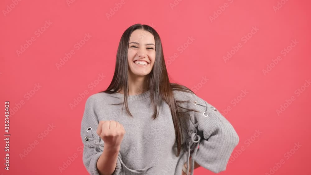 Yes, I done it. Close up of an excited cheerful female model with ...