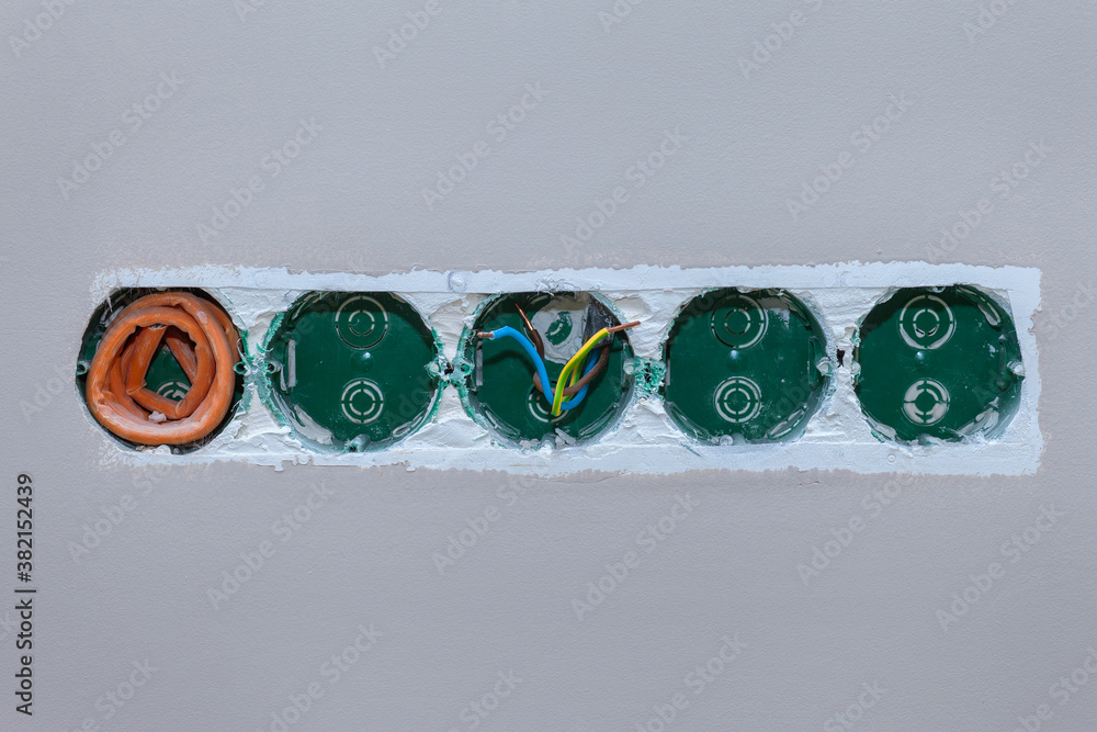 Installation of electrical outlets in the wall in the room. Stock Photo ...