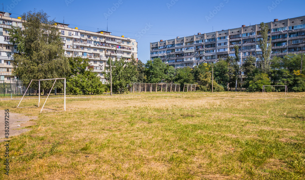 Old soccer field and rusty white soccer goals it the city near the ...
