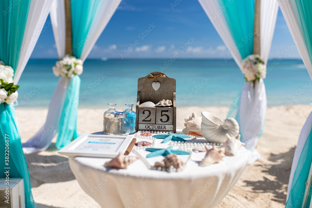 Close up view of table for the beach wedding ceremony with decoration ...