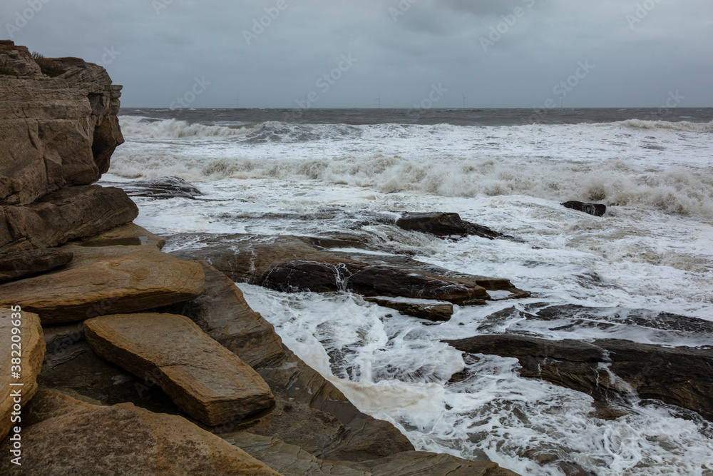 Rough, stormy, seas and waves on rock at Seaton Sluice, Northumberland ...