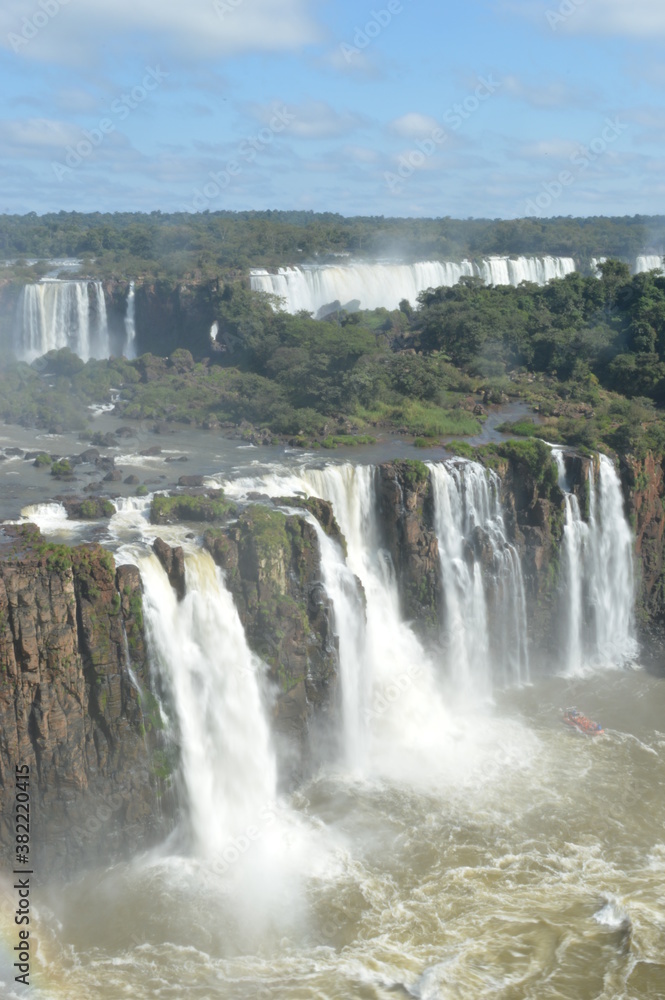Rainbows over the mighty and powerful Iguzu (Iguacu) Waterfalls between ...