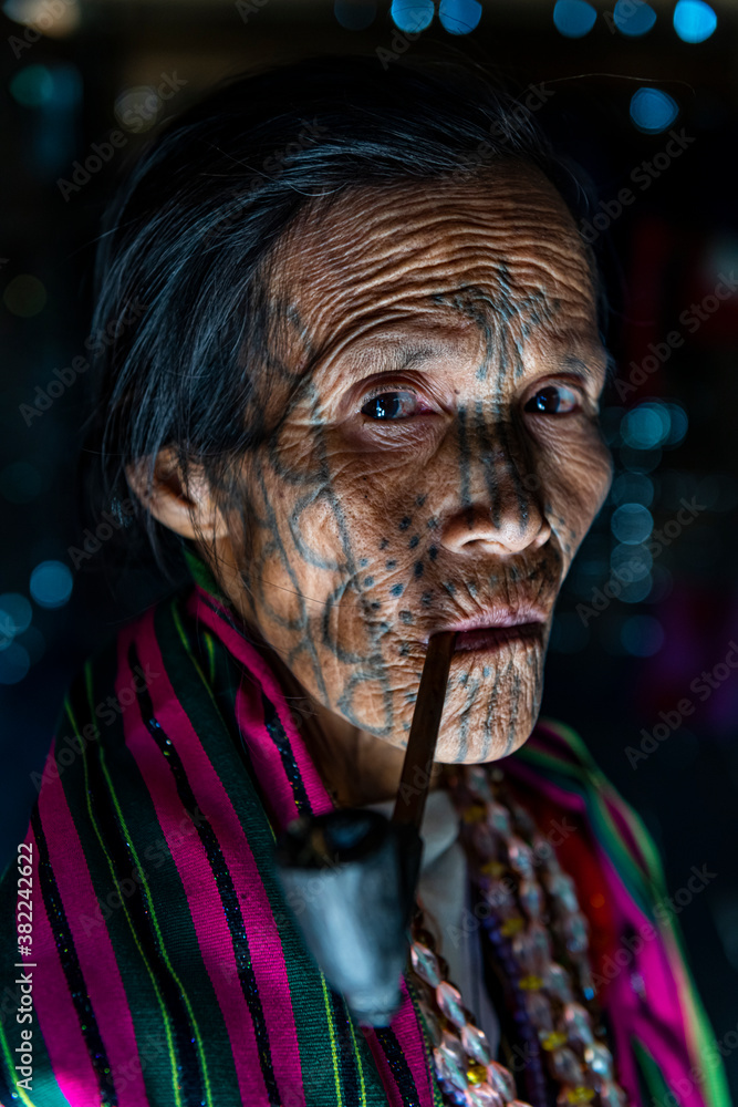 Chin woman with spiderweb tattoo smoking a pipe, Mindat, Chin state ...