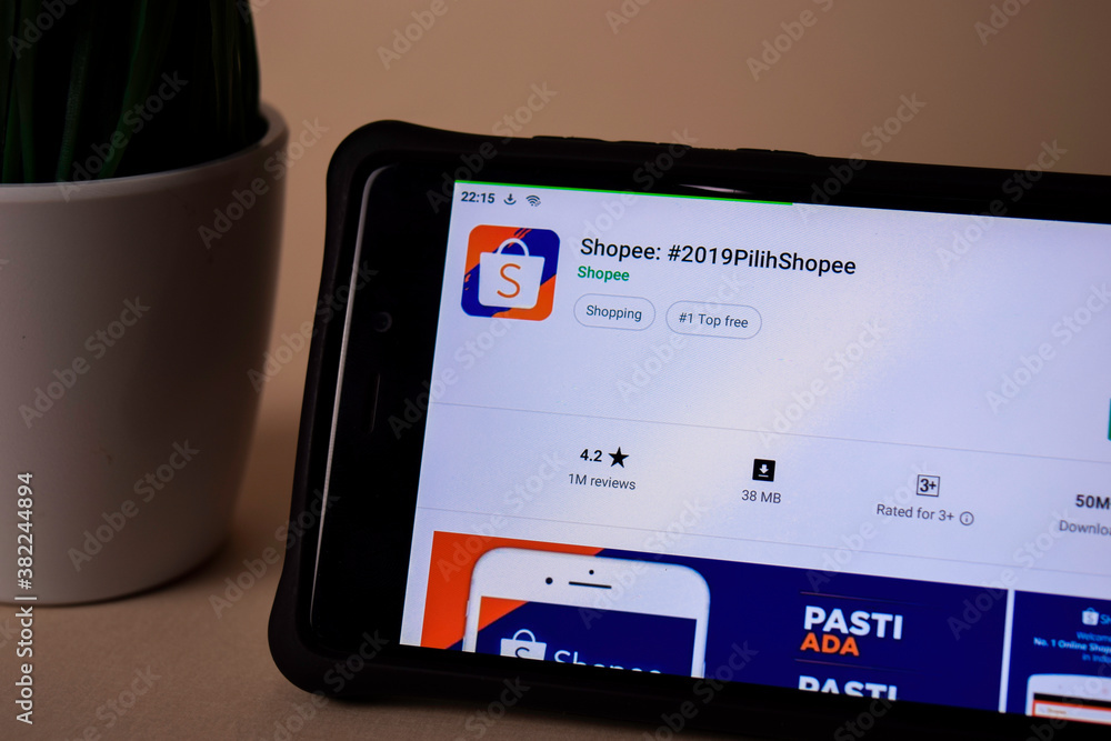 Shopee dev application on Smartphone screen. Easy Online Shopping is a ...