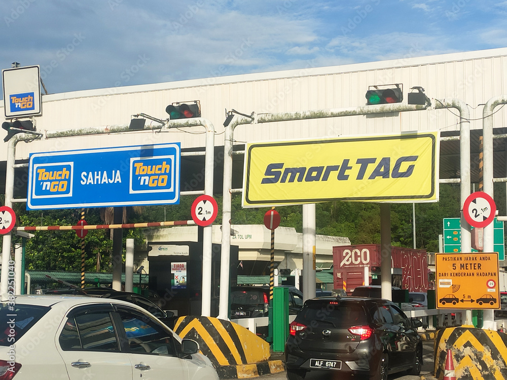 SEREMBAN, MALAYSIA -AUGUST, 2020: Vehicles entering highway toll canopy ...