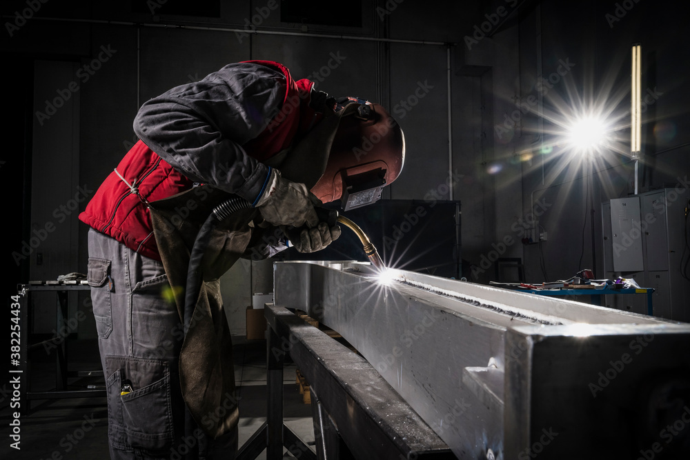 Welder that welds aluminum in his workshop Stock-Foto | Adobe Stock