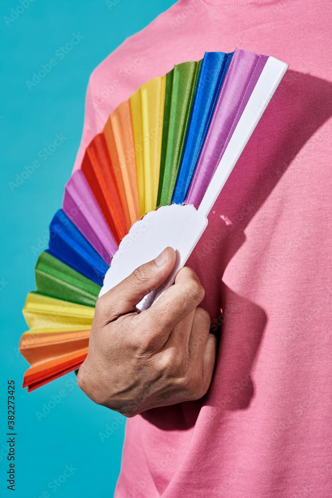 using a rainbow hand fan Stock Photo | Adobe Stock