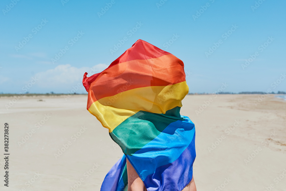 wrapped in a rainbow flag Stock Photo | Adobe Stock