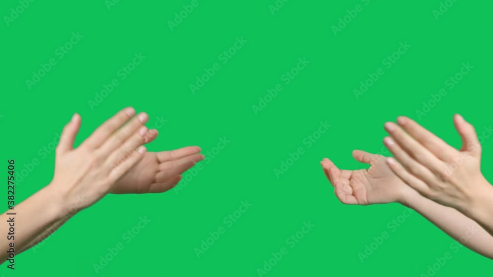 Hands are clapping on green screen background. Female hands silhouette ...