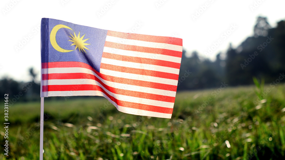 Malaysia flag waving celebrating "Merdeka" day Stock Photo | Adobe Stock