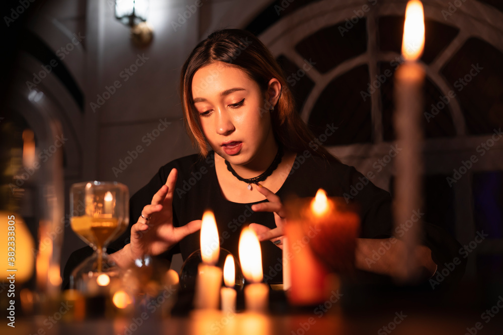 Beautiful young woman fortune teller predict the future with crystal ...