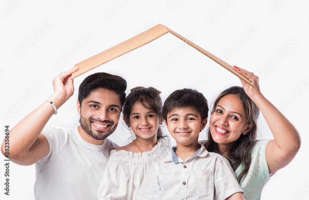 Real Estate Concept - Indian happy and young family of Four holding 3D ...