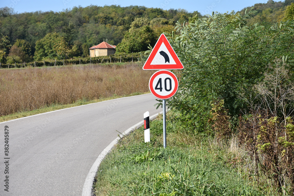 Road signs that shows maximum speed of 40 kilometers per hour and signa ...