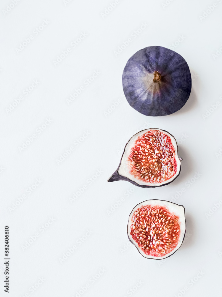 Figs Top view photo with copy space Two halves and whole fig on white ...