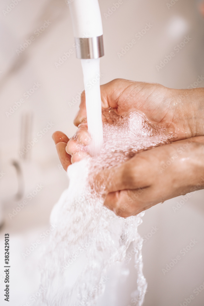 Washing Hands with streaming water under tap in bathroom. Hygiene,Hand ...