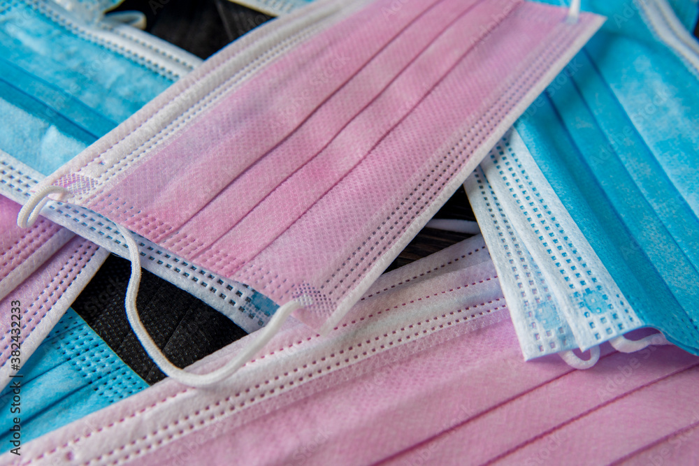 Fotka „Stack / pile of disposable colorful medical face masks (surgical ...