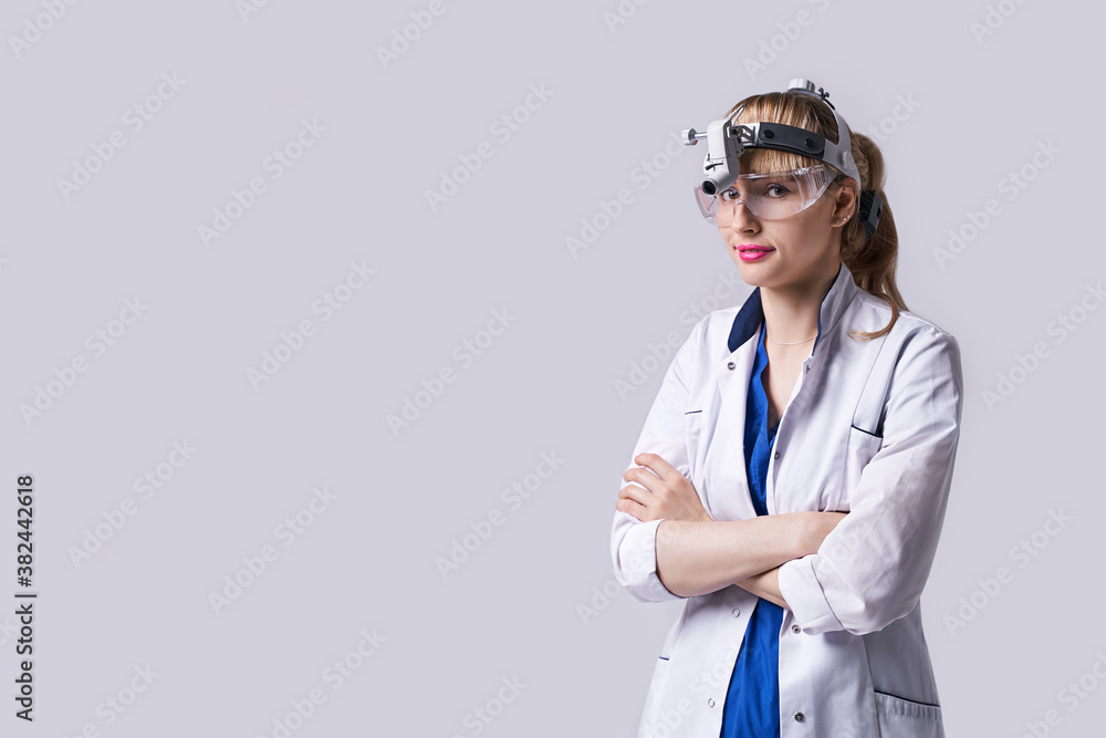 Confident ENT doctor wearing surgical headlight head light and ...