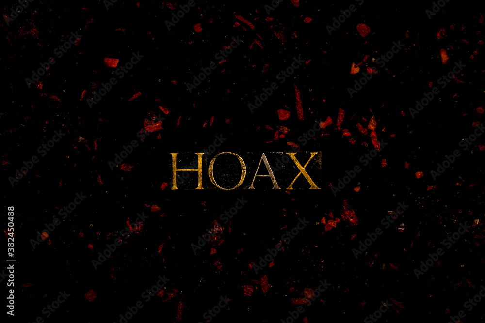 Hoax text in neon letters on black background with red virus particles ...