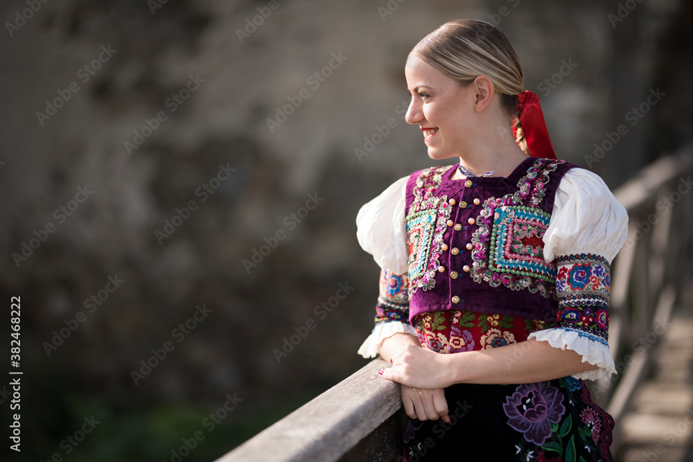 Young beautiful slovak woman in traditional costume. Slovak folklore ...