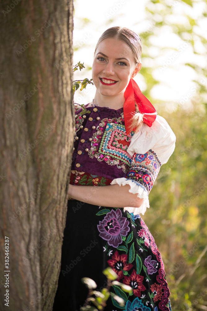 Young beautiful slovak woman in traditional costume. Slovak folklore ...