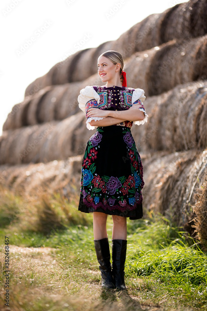 Young beautiful slovak woman in traditional costume. Slovak folklore ...