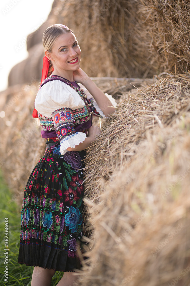 Young beautiful slovak woman in traditional costume. Slovak folklore ...