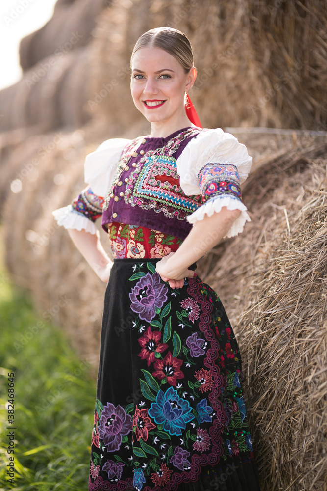 Young beautiful slovak woman in traditional costume. Slovak folklore ...