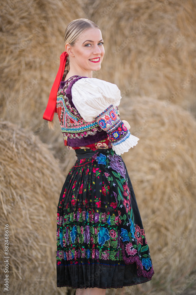 Young beautiful slovak woman in traditional costume. Slovak folklore ...