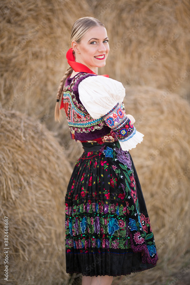 Young beautiful slovak woman in traditional costume. Slovak folklore ...